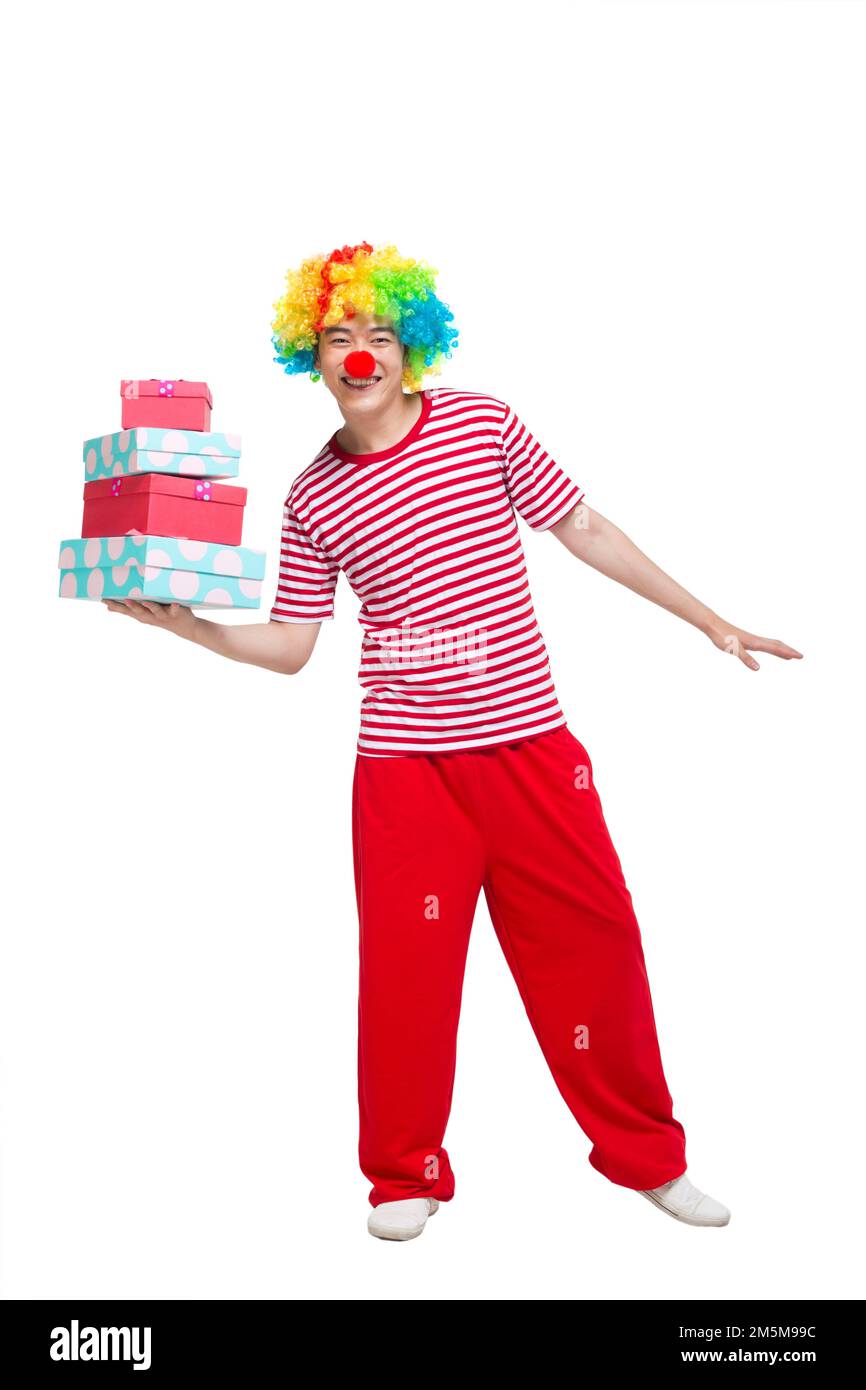 Shed film happy funny clown, gift box Stock Photo - Alamy