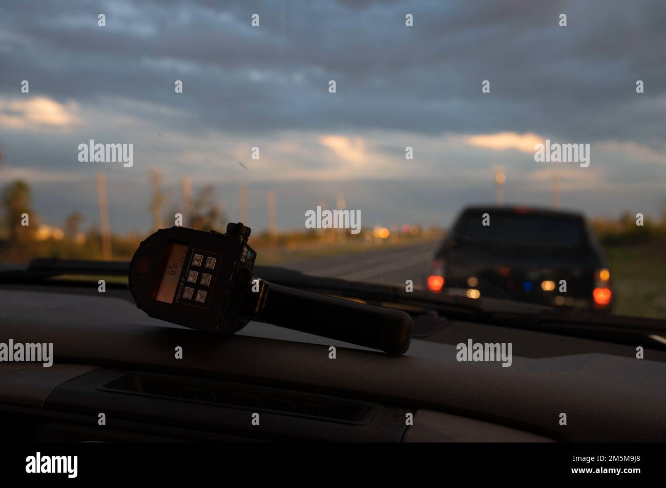 A radar gun displays the speed of a vehicle during a traffic violation ...