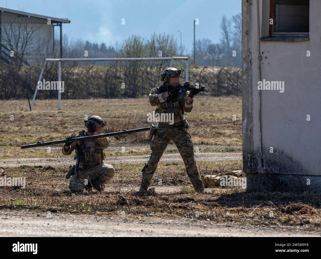 U.S. Special Forces members demonstrate the proper way to place a ...