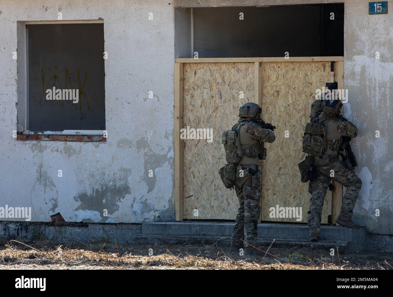 U.S. Special Forces members demonstrate the proper way to place a ...