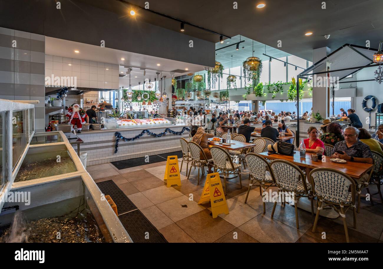 Diners at an indoor seafood restaurant at Sydney Fish Market, Sydney ...