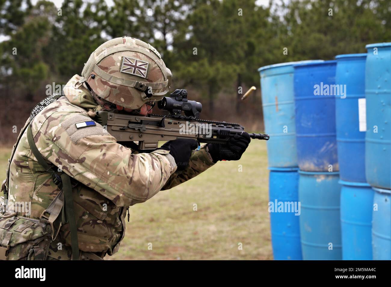 A British service member runs a shooting lane during the AFSAM/WPW ...