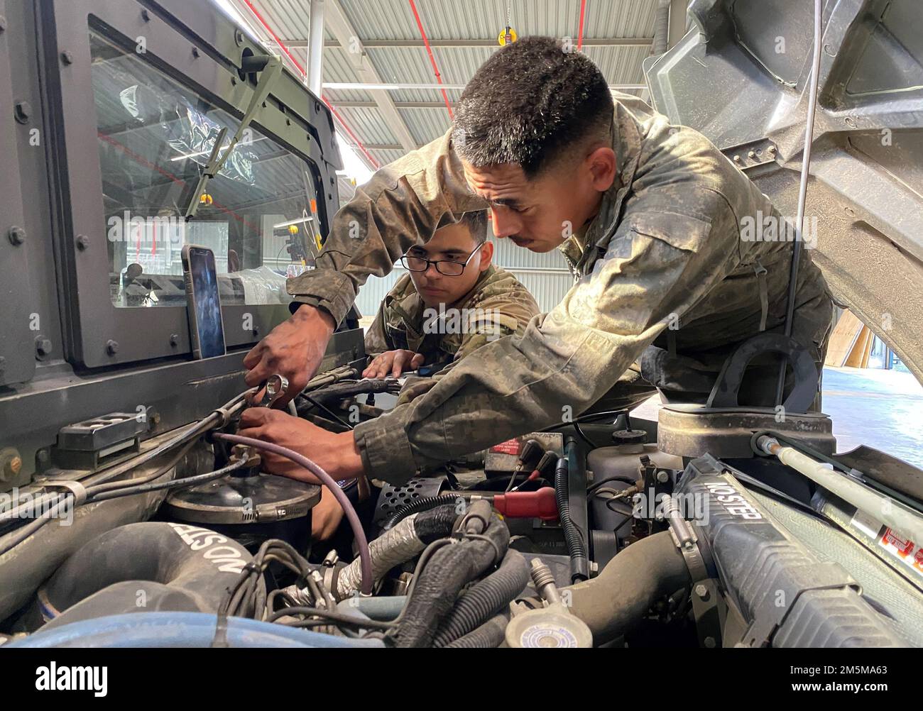 Two Soldiers from the automotive shop, Bravo Company , 87th Division ...