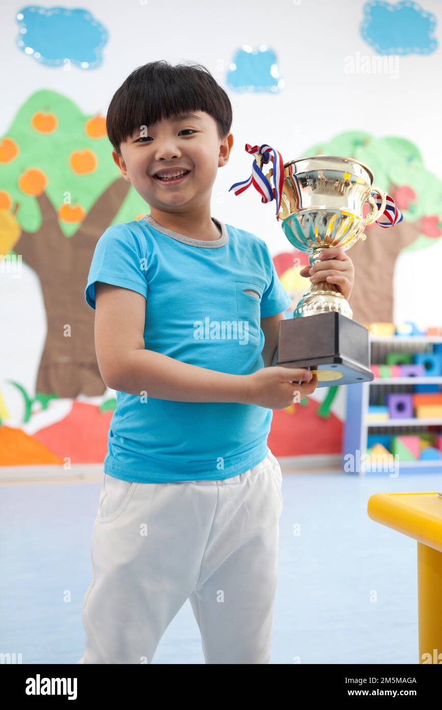 Kindergarten children children the trophy Stock Photo - Alamy