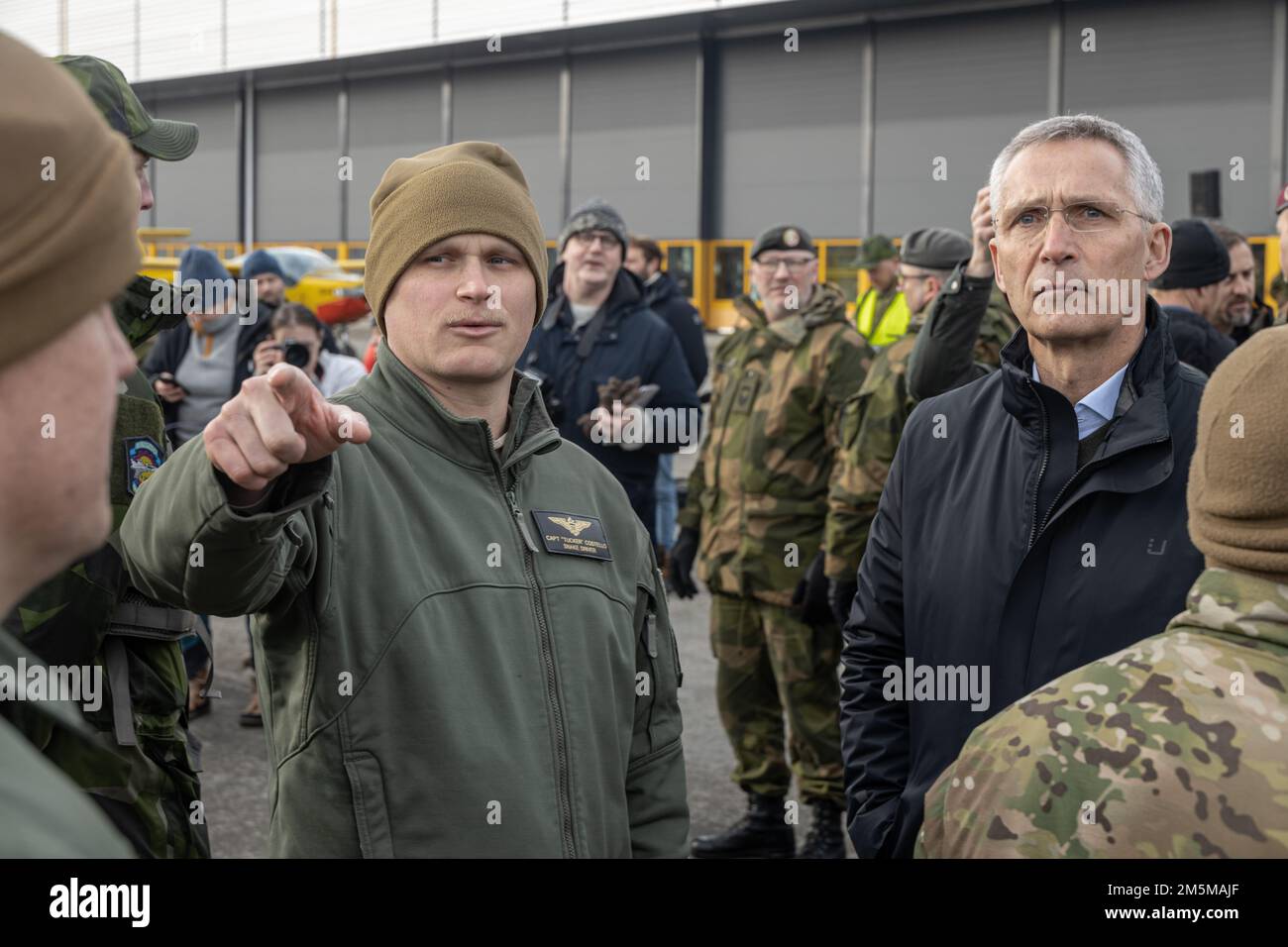 U.S. Marine Corps Capt. Reilly Costello points out an AH-1Z Cobra to ...