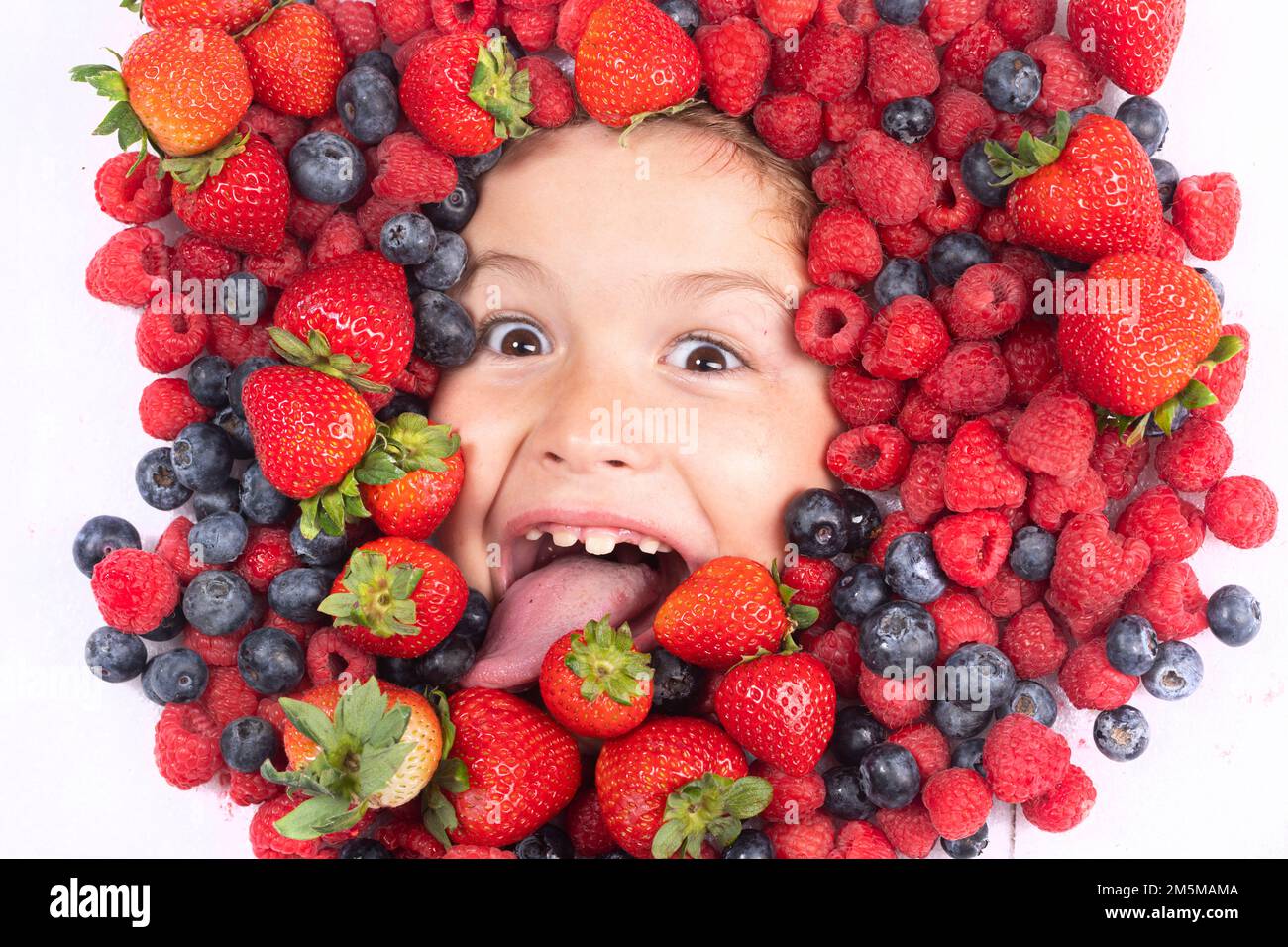 Funny fruits. The kids face with fruit and berries. Summer strawberry ...