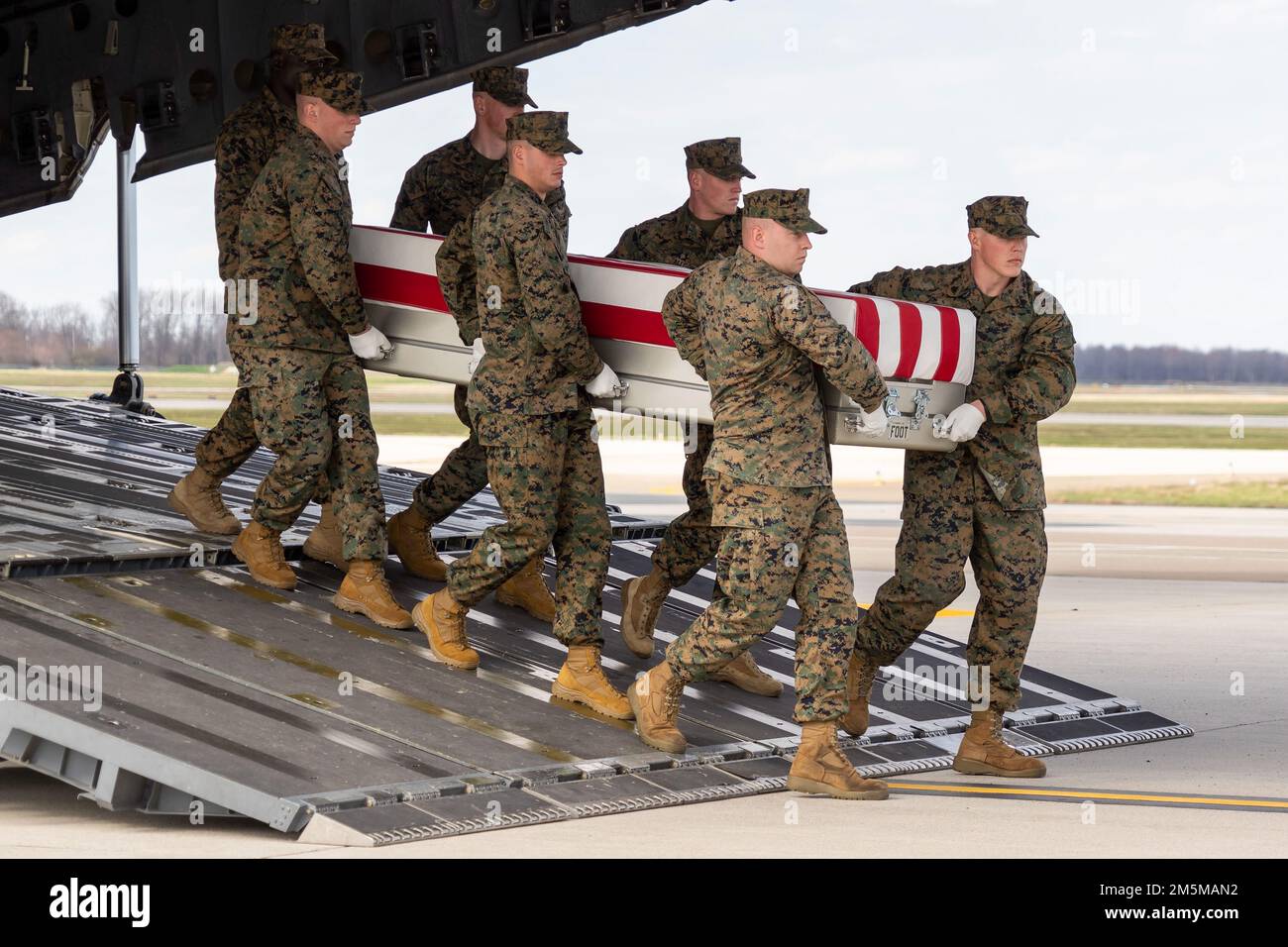 A U.S. Marine Corps carry team transfers the remains of Marine Capt ...