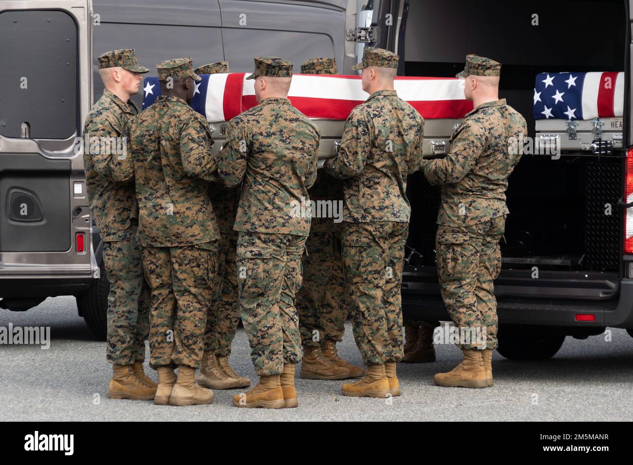 A U.S. Marine Corps carry team transfers the remains of Marine Capt ...