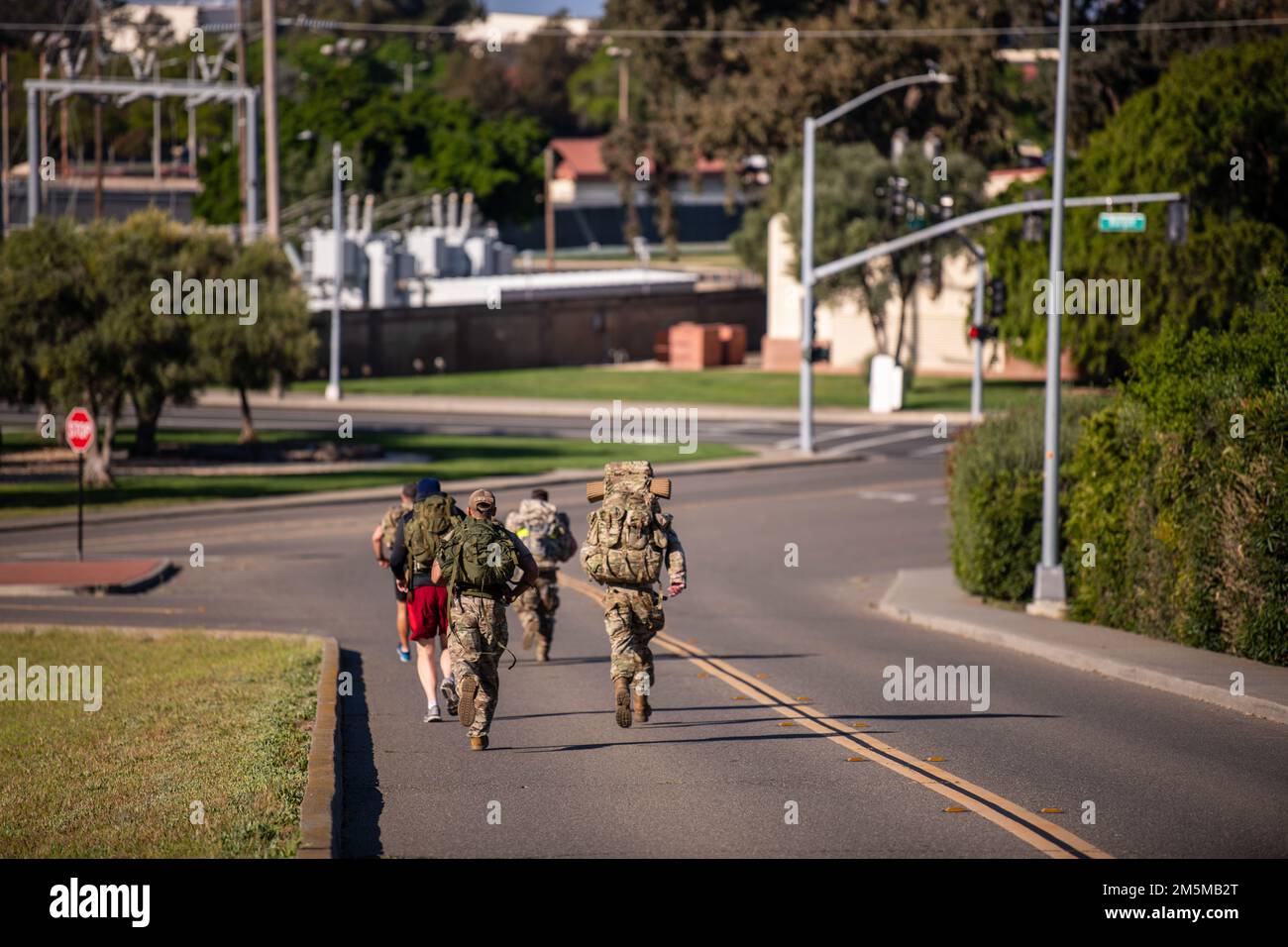 U.S. Airmen participate in a 5k memorial ruck march honoring Master Sgt ...