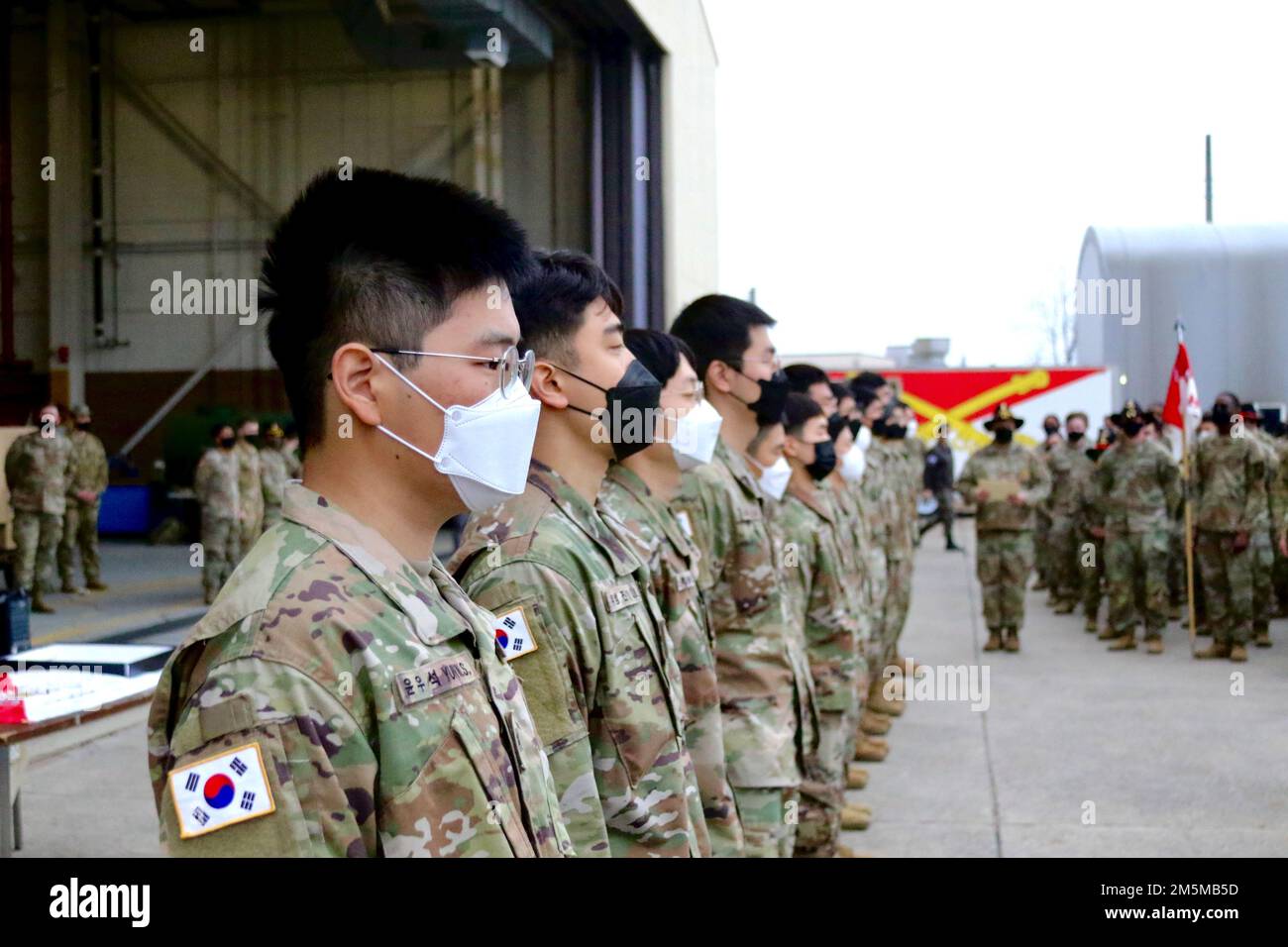 Korean Augmentees to the United States Army (KATUSA) are presented a ...
