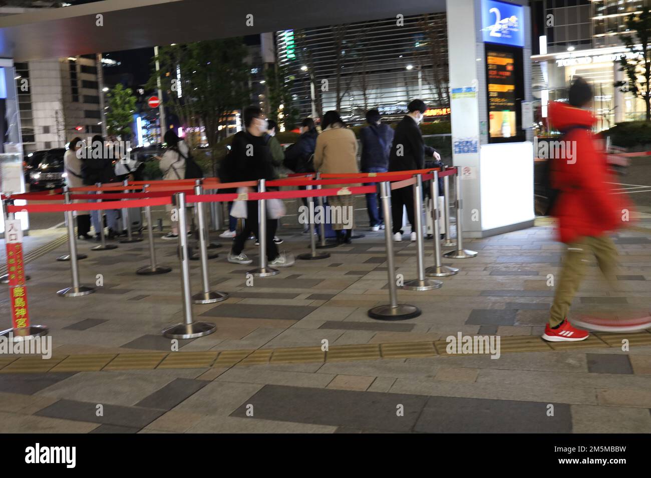 Chiyoda Ward, Tokyo, Japan, December 2022.People waiting for a highway ...