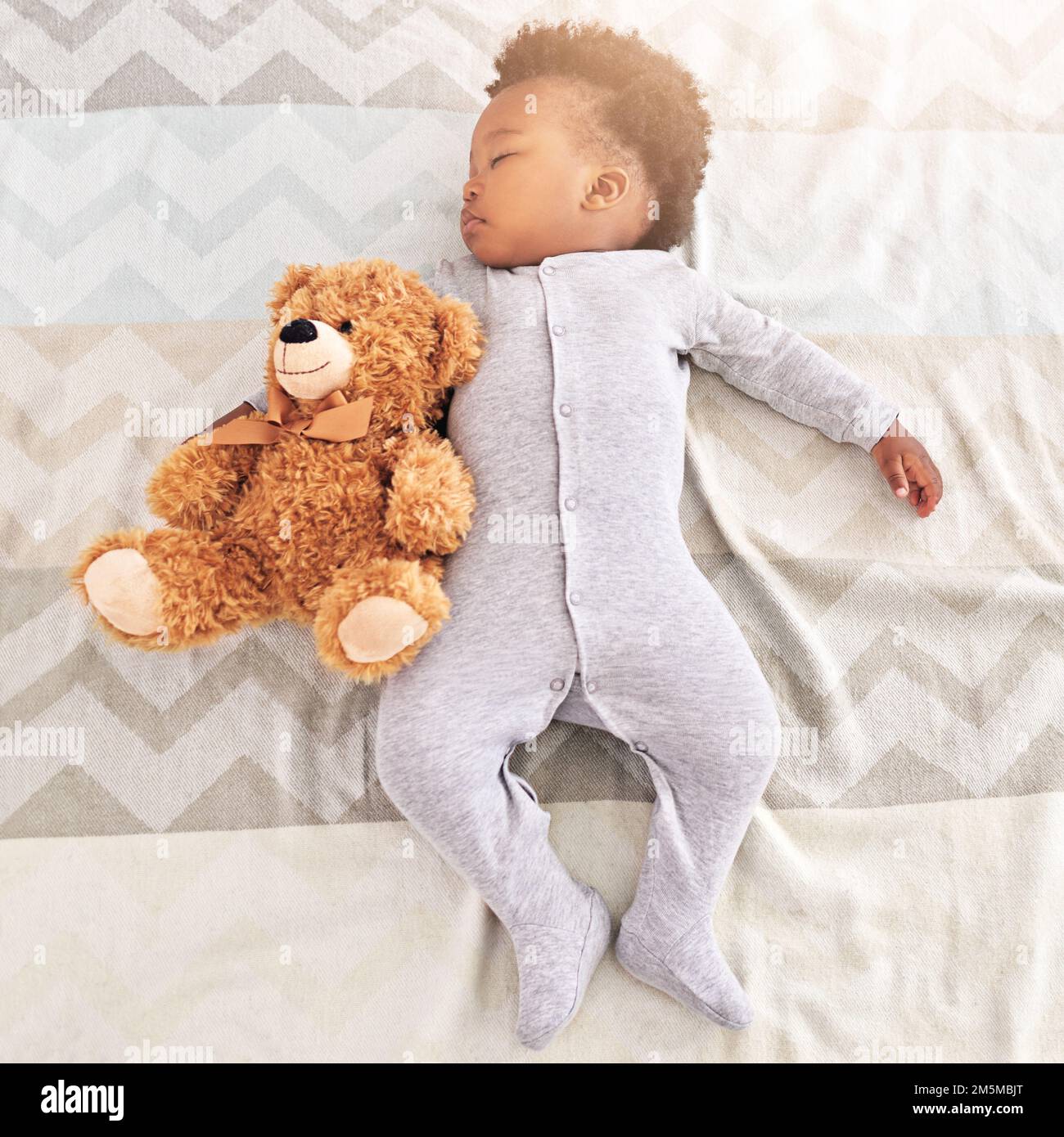 Sound asleep in a peaceful slumber. High angle shot of a little baby ...