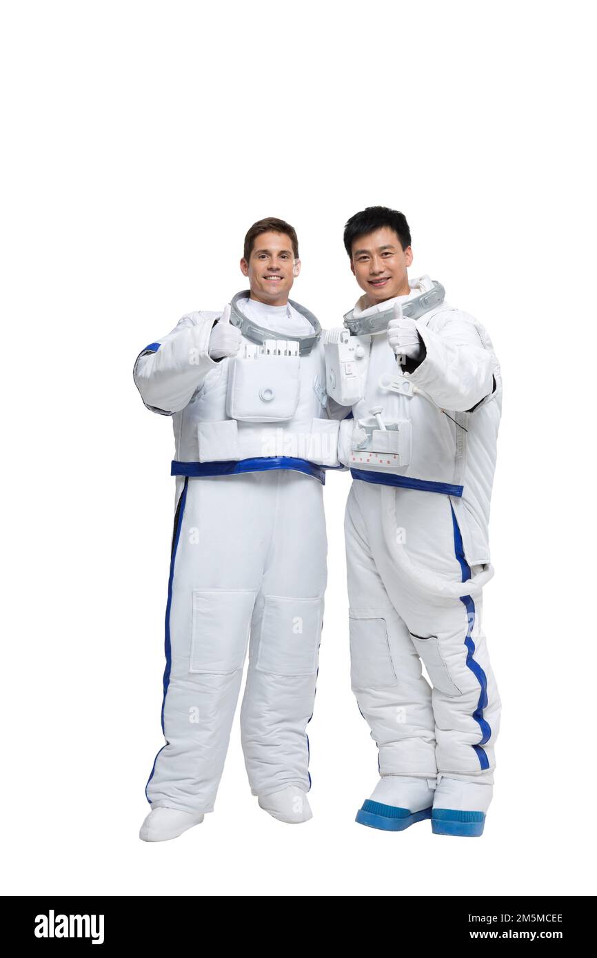Two astronauts in space suits hi-res stock photography and images - Alamy