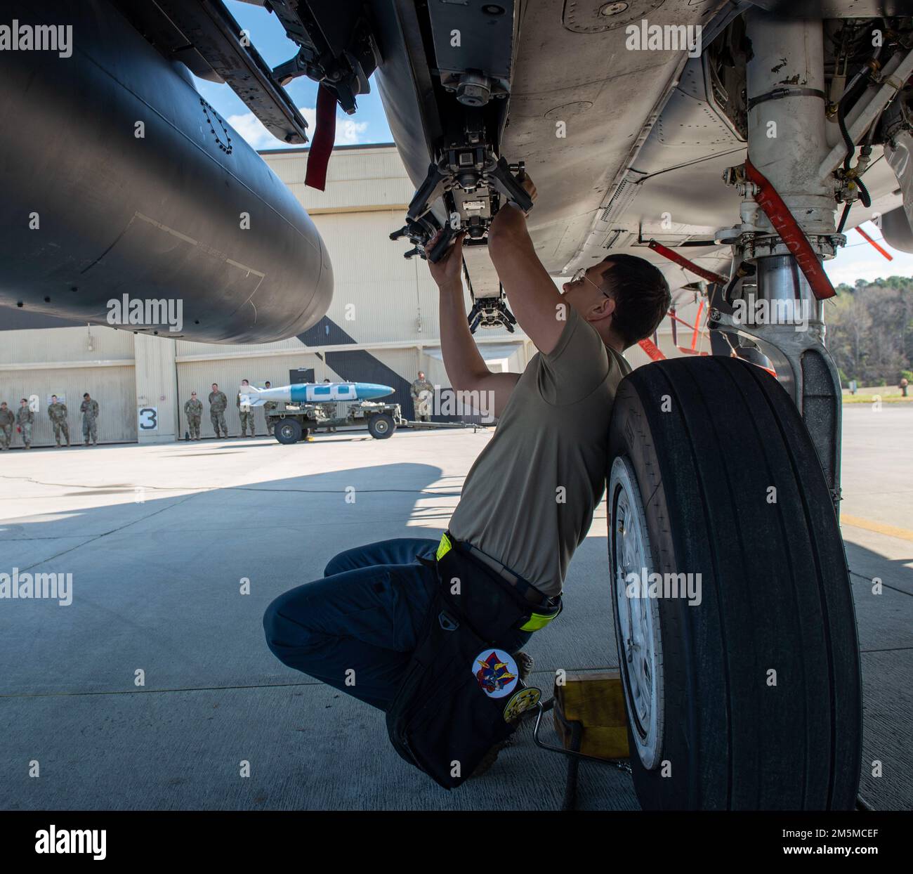 A weapons load crew Airman assigned to the 336th Fighter Generation ...