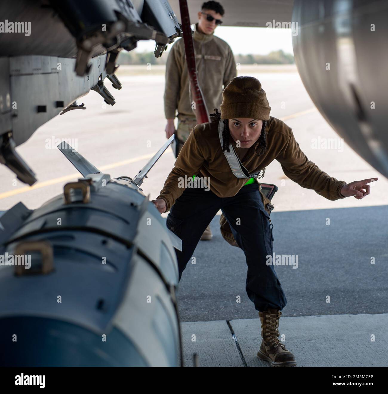 A weapons load crew Airman assigned to the 335th Fighter Generation ...