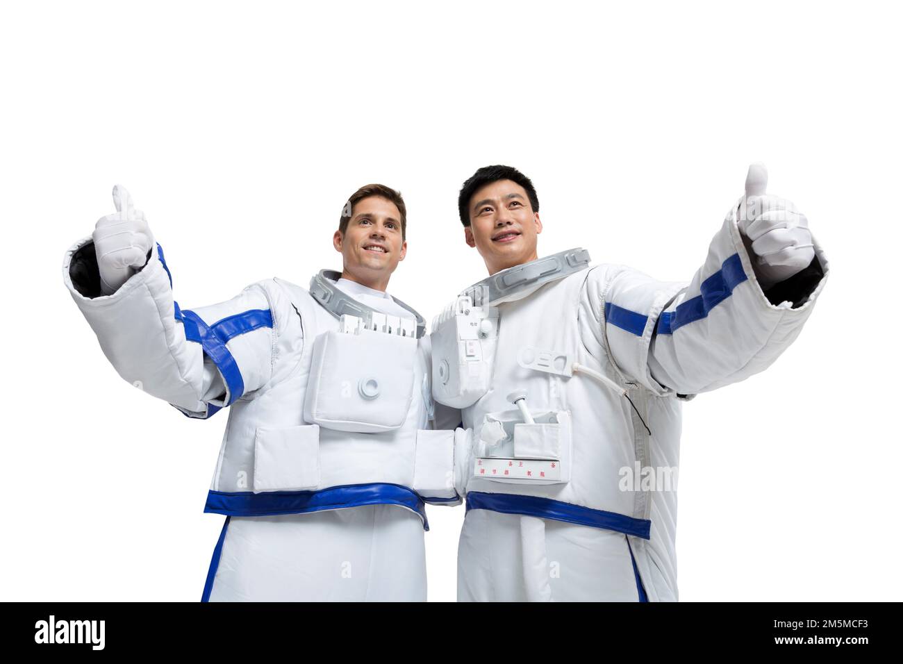 Two astronauts in space suits hi-res stock photography and images - Alamy