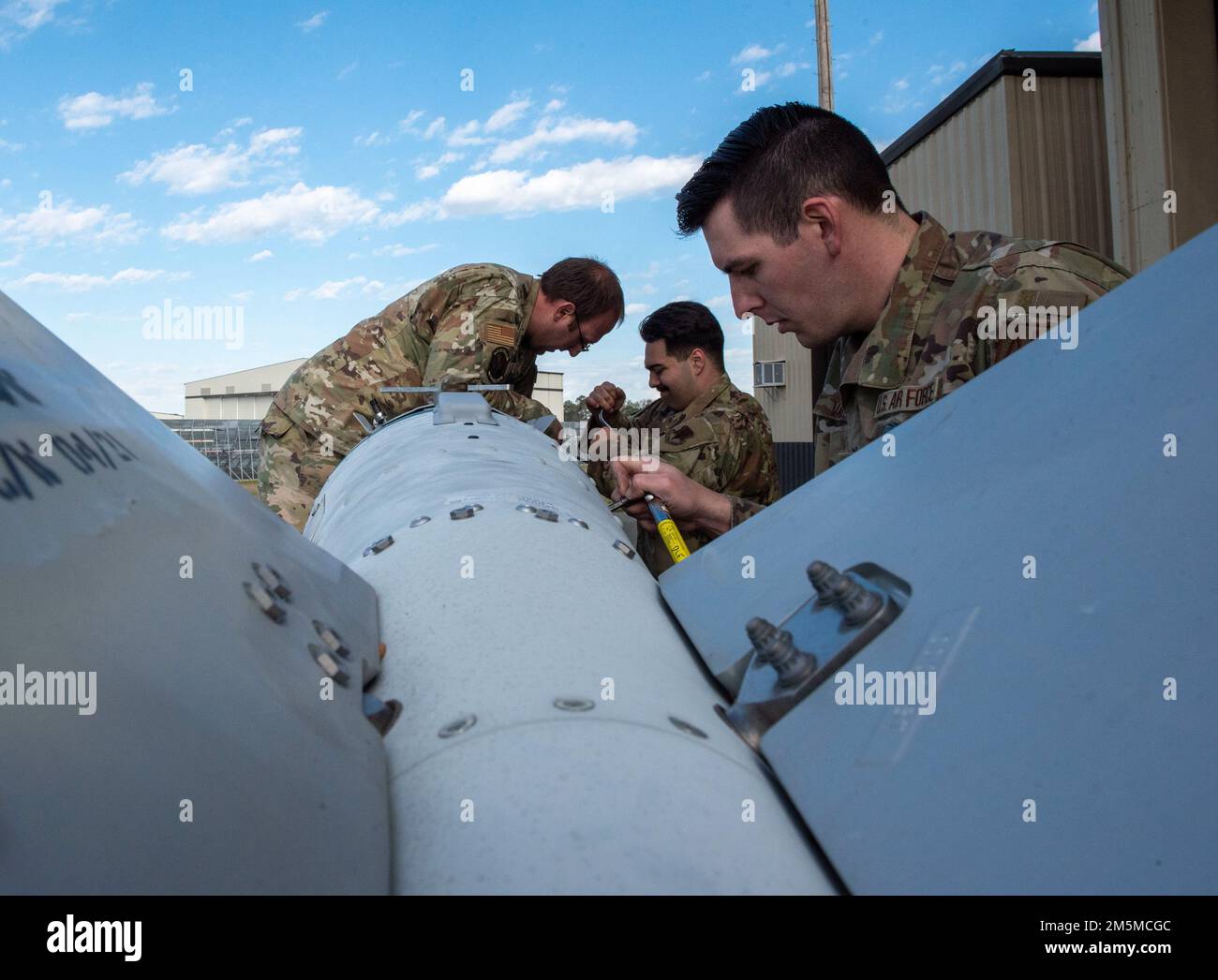 Ammunition specialists assigned to the 4th Munitions Squadron build an ...