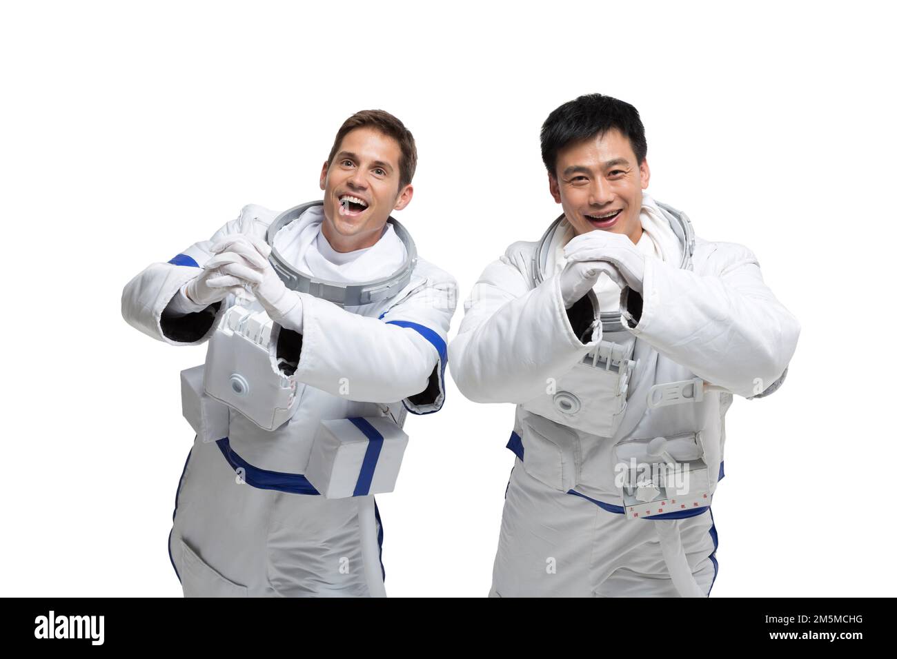 Two astronauts in space suits hi-res stock photography and images - Alamy
