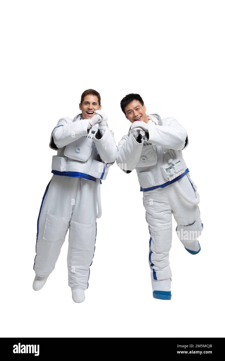 Two astronauts in space suits hi-res stock photography and images - Alamy
