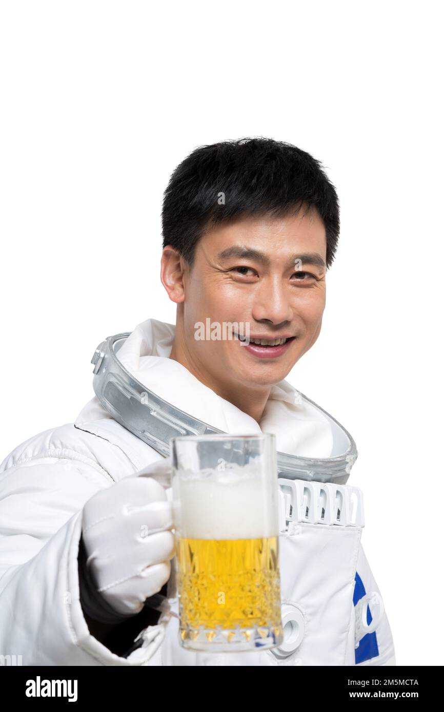 Shed male astronauts drink beer to celebrate Stock Photo - Alamy