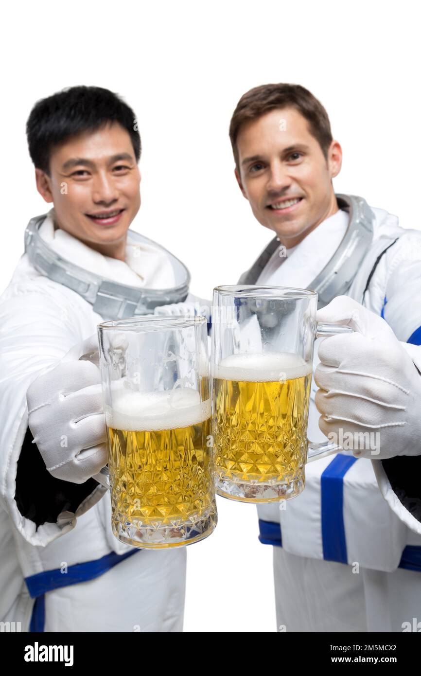 Shed male astronauts drink beer to celebrate Stock Photo - Alamy