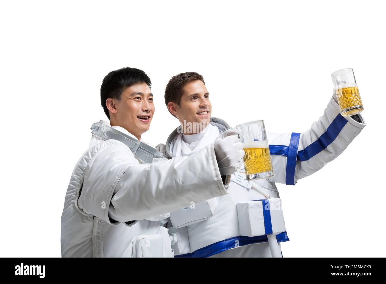 Shed male astronauts drink beer to celebrate Stock Photo - Alamy