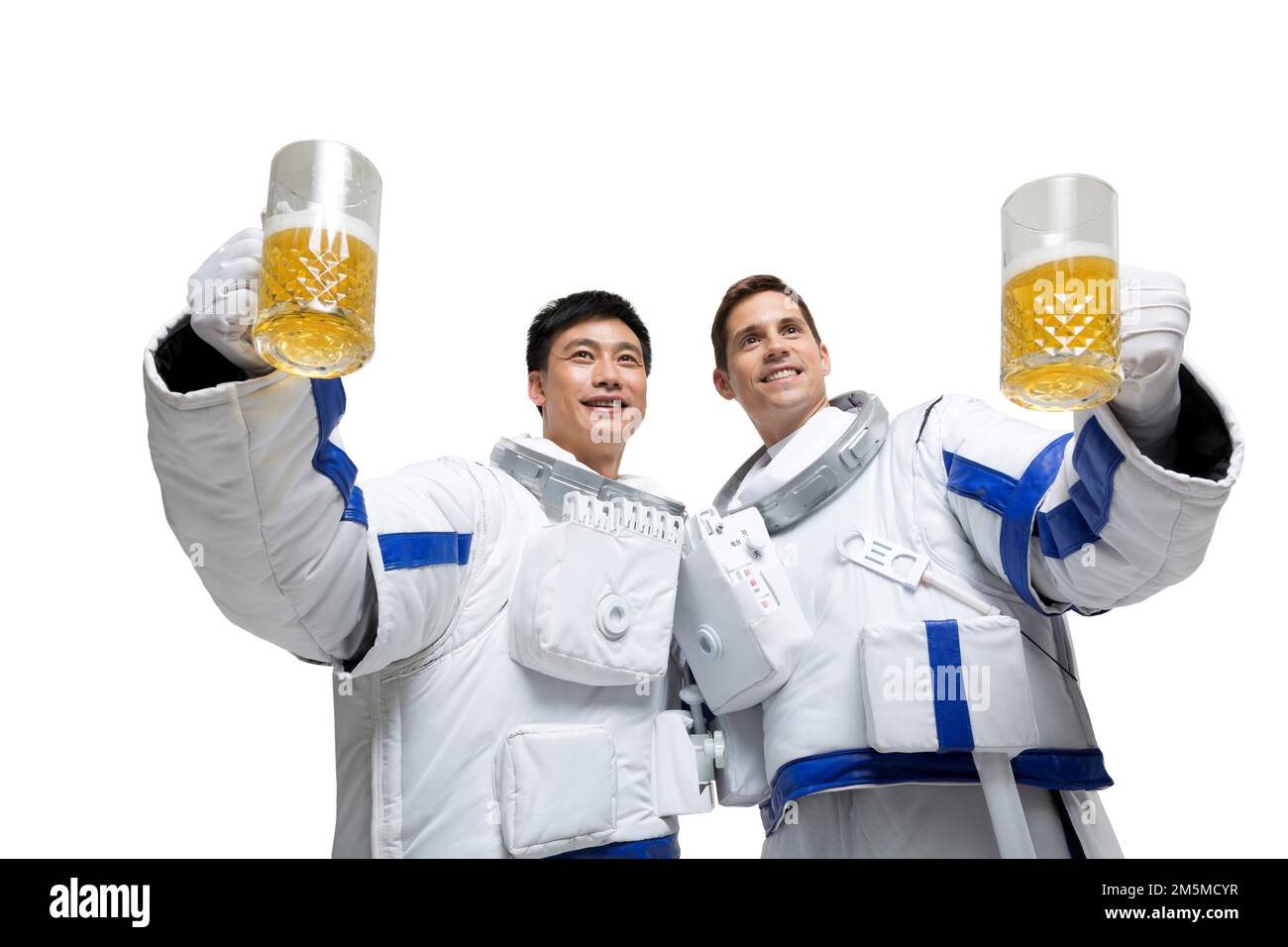 Shed male astronauts drink beer to celebrate Stock Photo - Alamy