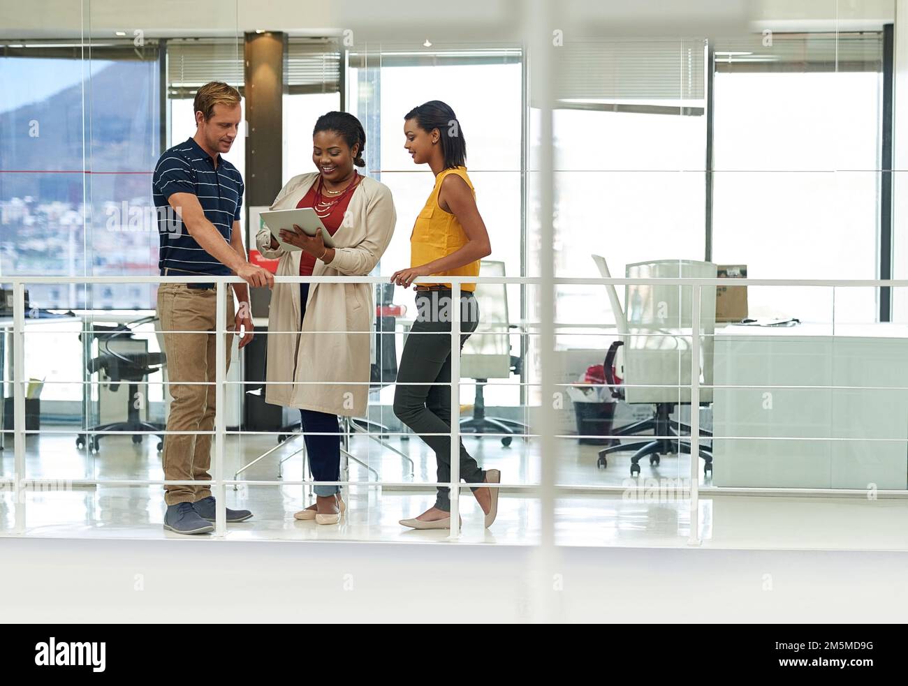 Three great minds working together. a three work colleagues talking ...