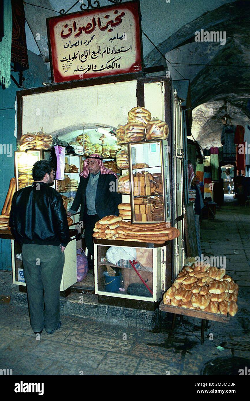 A Palestinian man selling Ka'ak bread from his little shop in the ...
