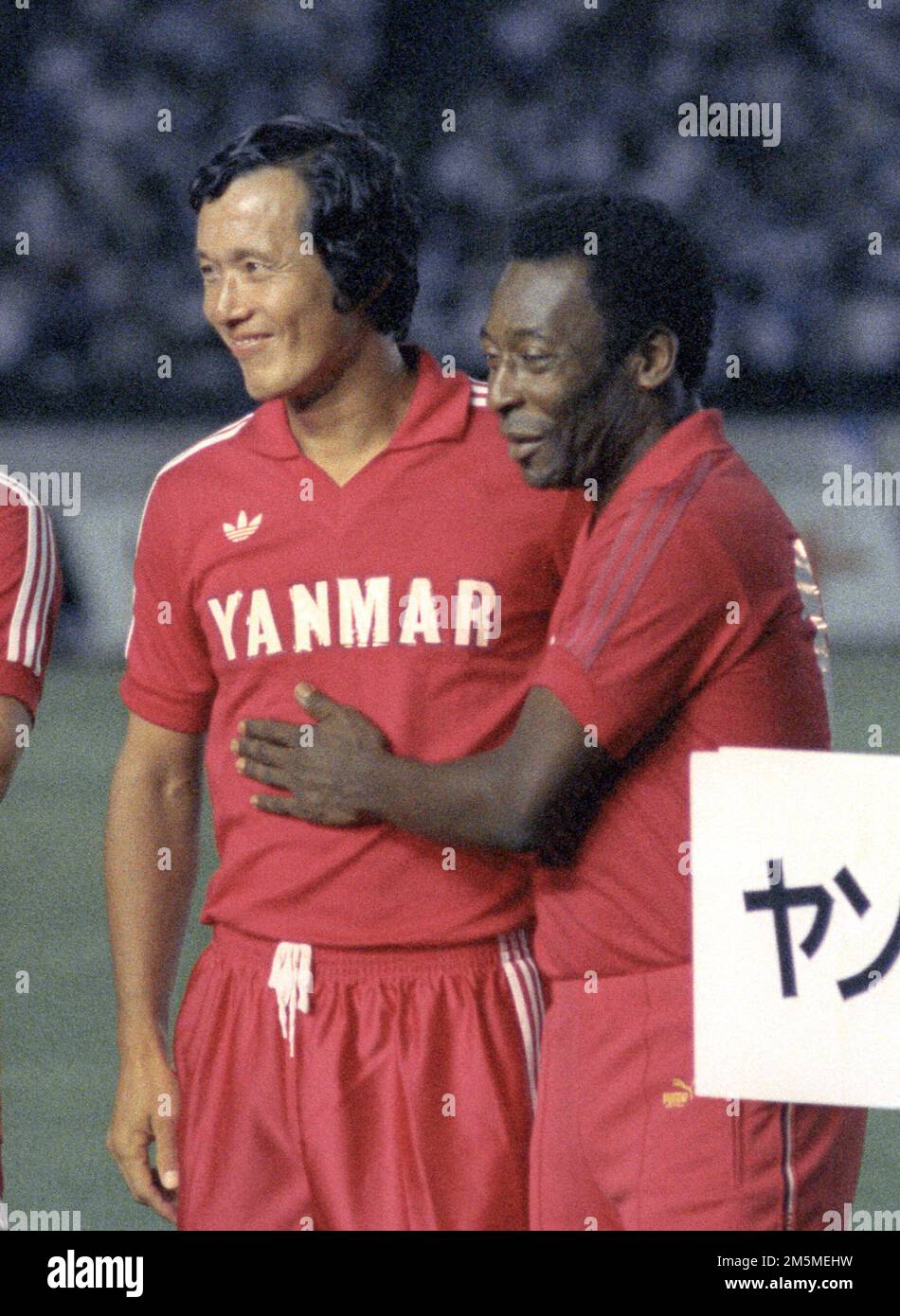 File photo taken in August 1984 shows Pele (R) talking to Japanese ...