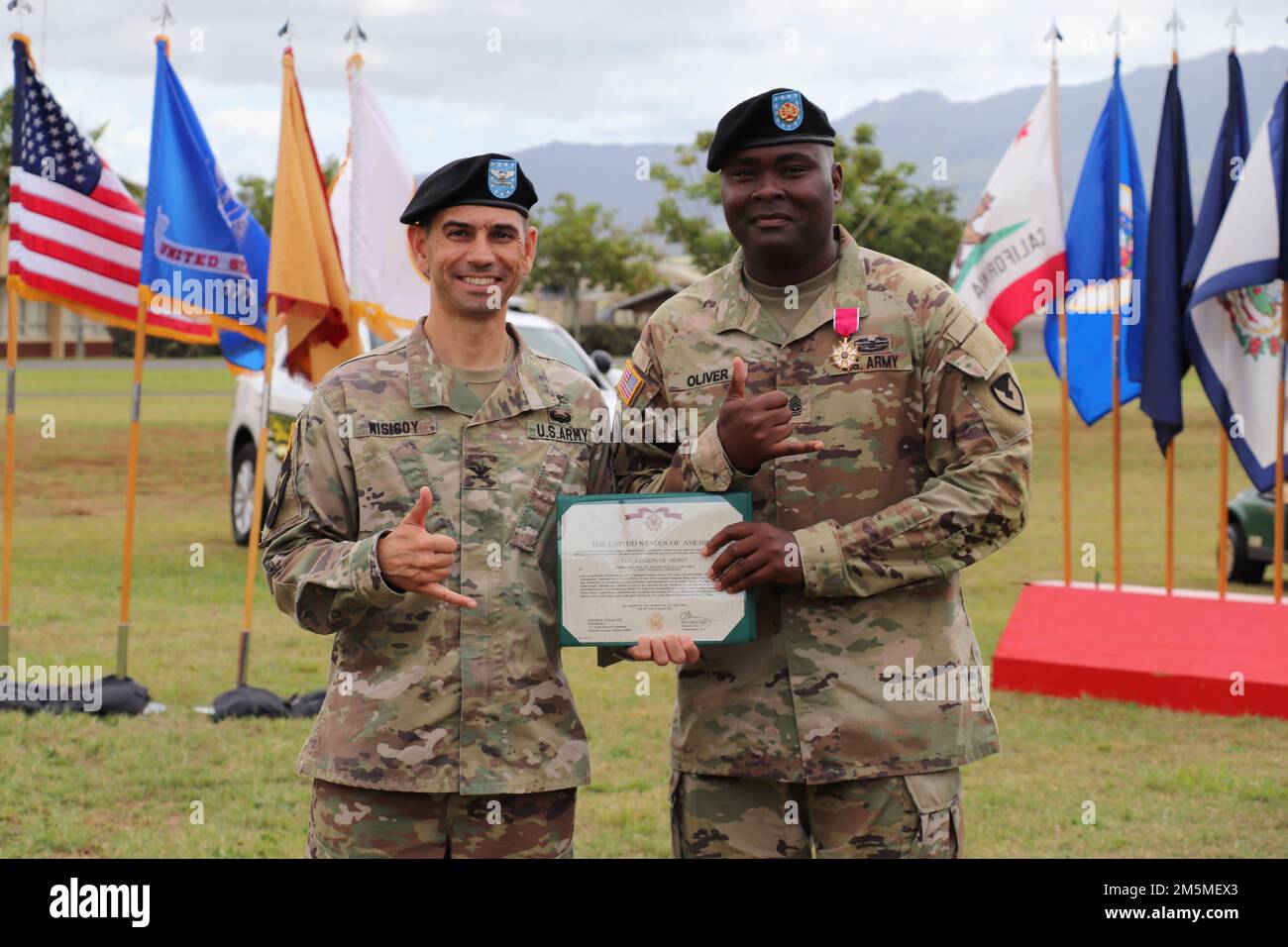 U.S. Army Garrison Hawaii, commander, Col. Daniel Misigoy presents an ...