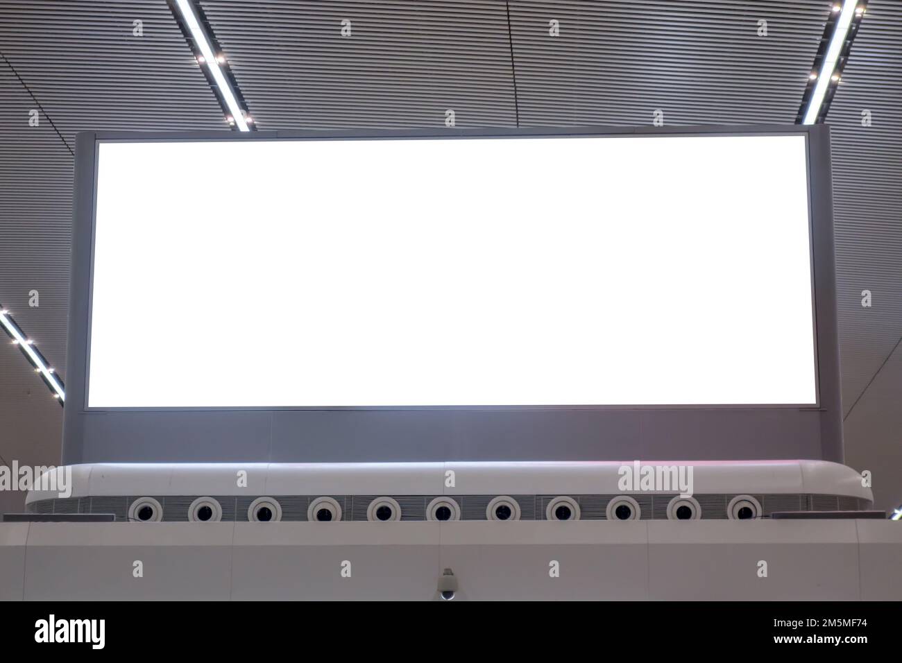 A low angle shot of a white cinema screen with copy space in a modern ...