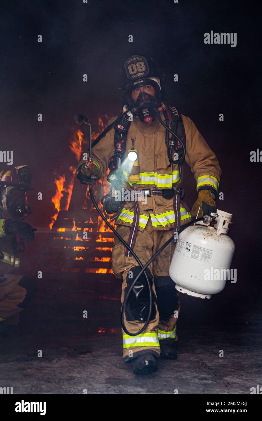 A firefighter with Marine Corps Installations Pacific Fire and ...