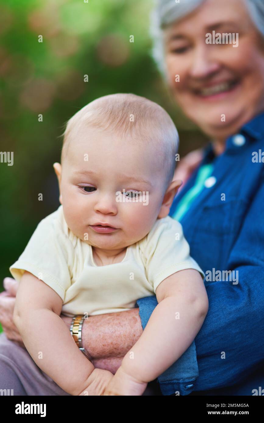 Thank heaven for little boys. a baby boy with his family outdoors Stock ...
