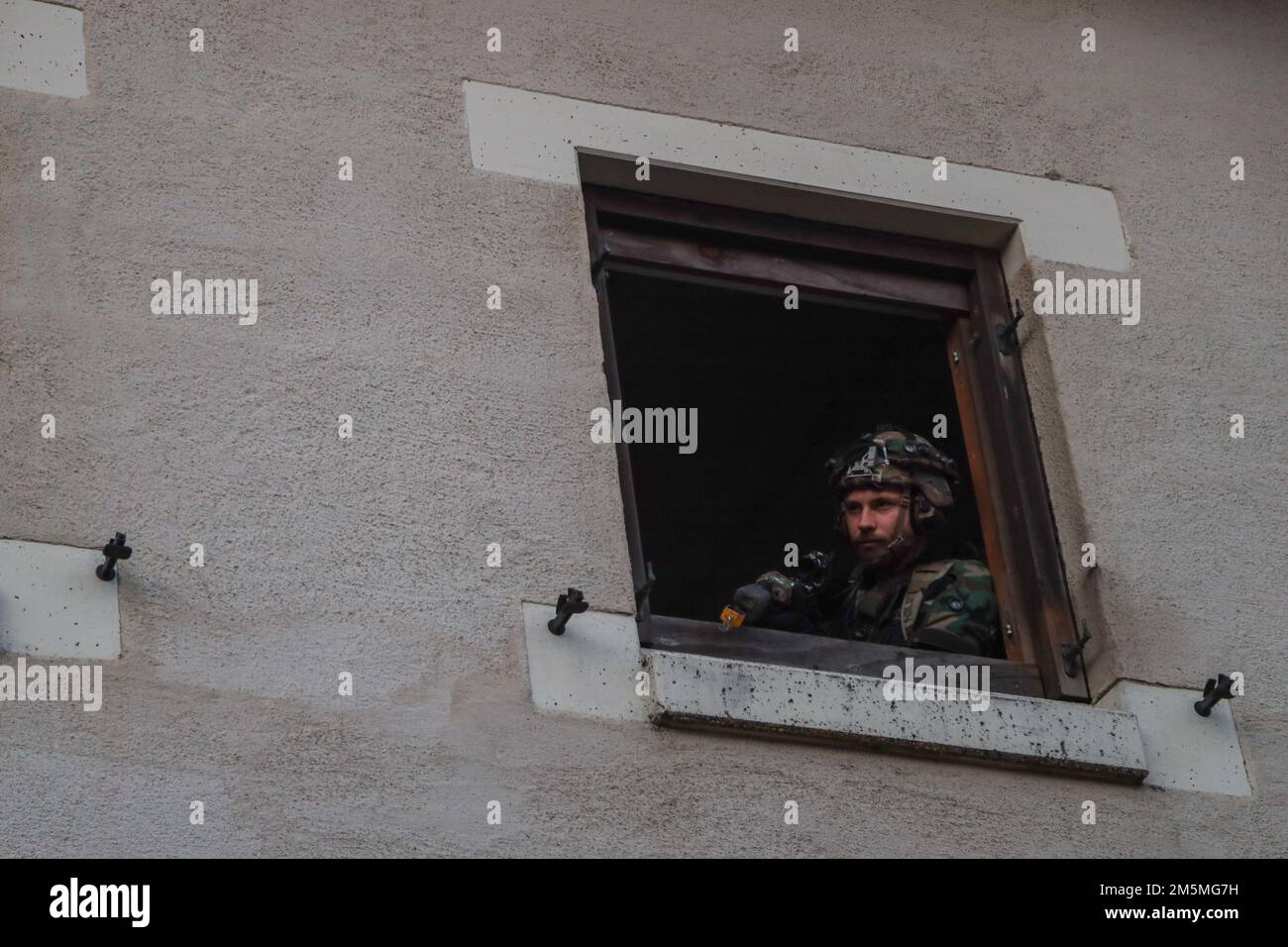 A U.S. Soldier, attached to 1st Battalion, 4th Infantry Regiment, acts ...