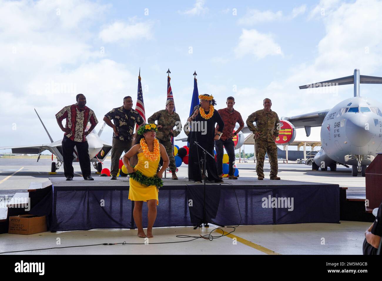 Polynesian dancers demonstrate different dance moves to airmen assigned ...