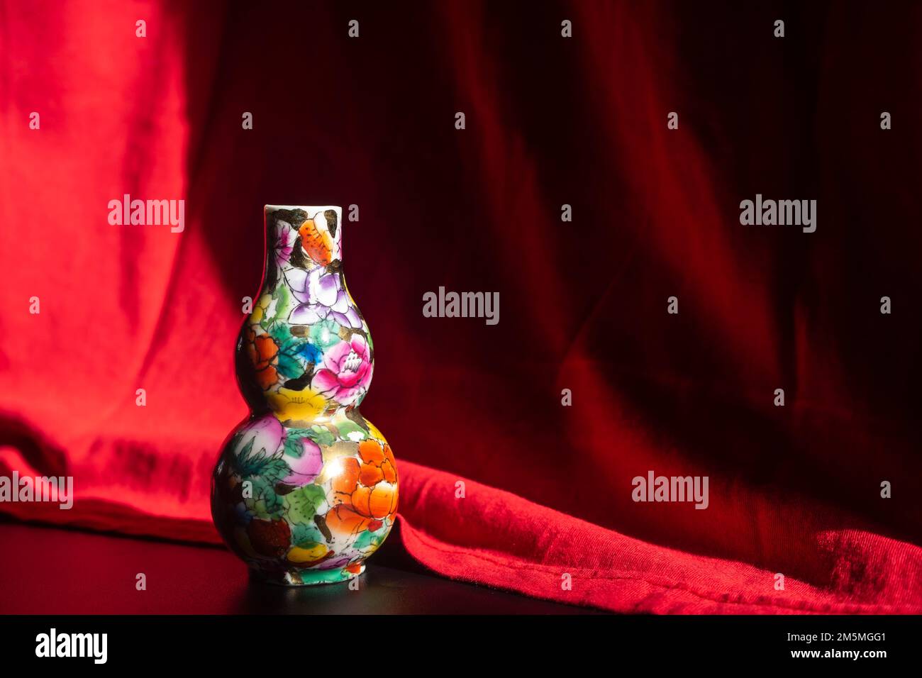 Chinese ceramic in an auction against a red background. Chinese New ...