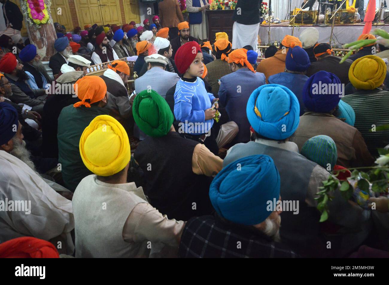 Peshawar, Pakistan. 28th Dec, 2022. Sikh devotees take part in a ...