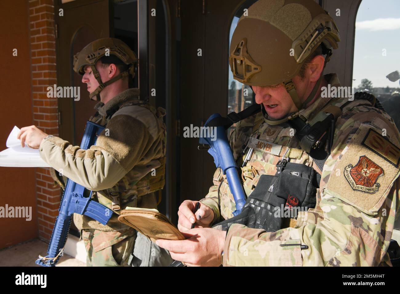 90th Security Forces Group personnel take notes during Exercise ...