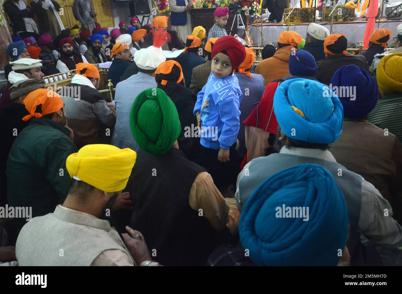 Peshawar, Pakistan. 28th Dec, 2022. Sikh devotees take part in a ...