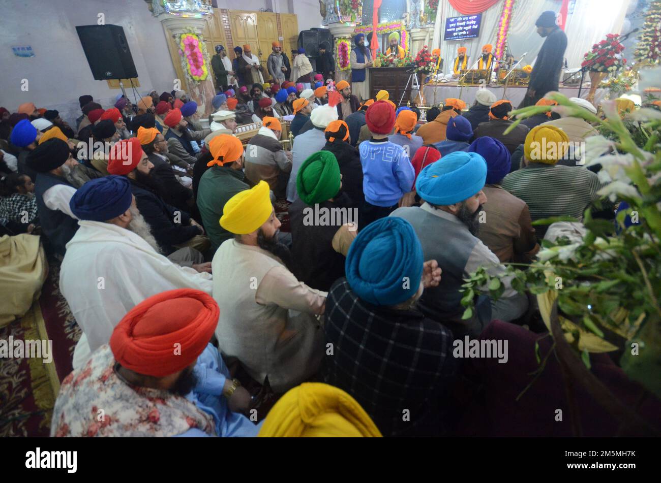 Peshawar, Pakistan. 28th Dec, 2022. Sikh devotees take part in a ...