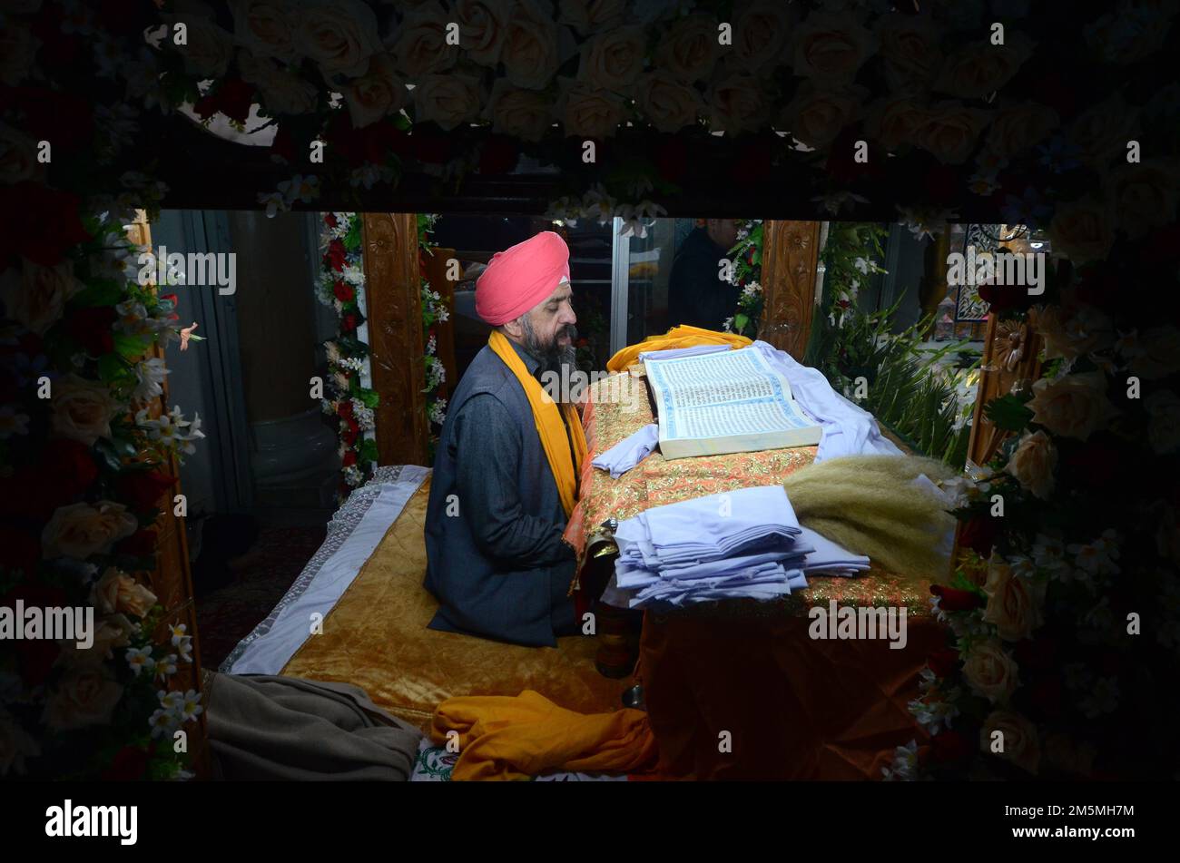 Peshawar, Pakistan. 28th Dec, 2022. Sikh devotees take part in a ...