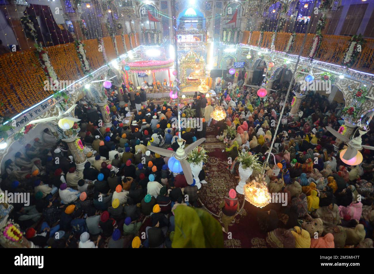 Peshawar, Pakistan. 28th Dec, 2022. Sikh devotees take part in a ...