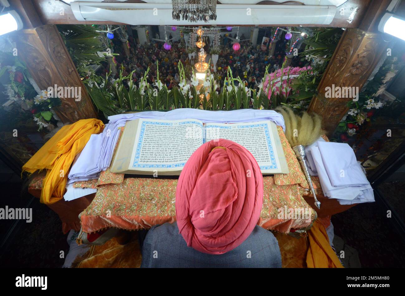 Peshawar, Pakistan. 28th Dec, 2022. Sikh devotees take part in a ...