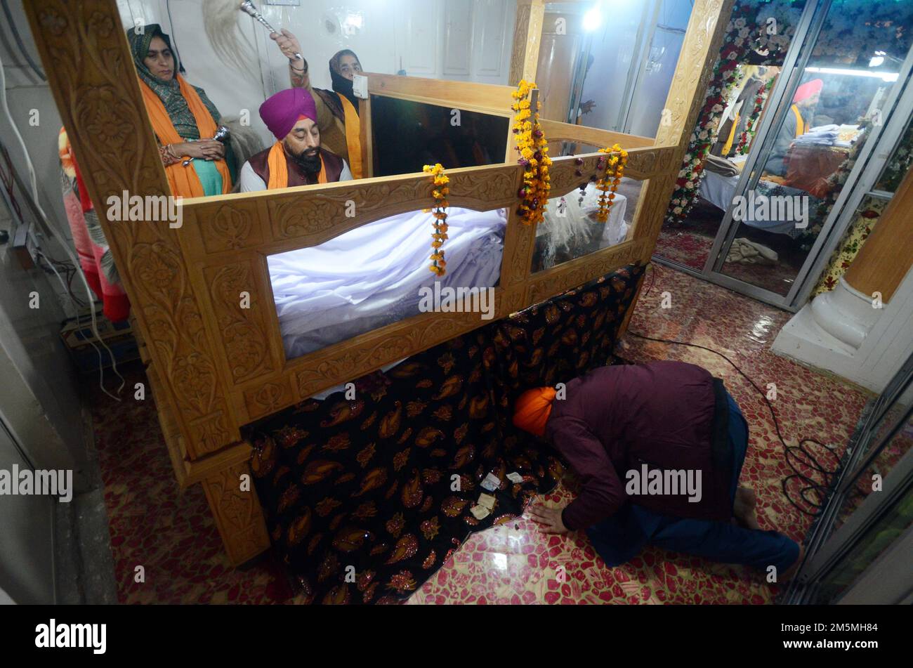 Peshawar, Pakistan. 28th Dec, 2022. Sikh devotees take part in a ...