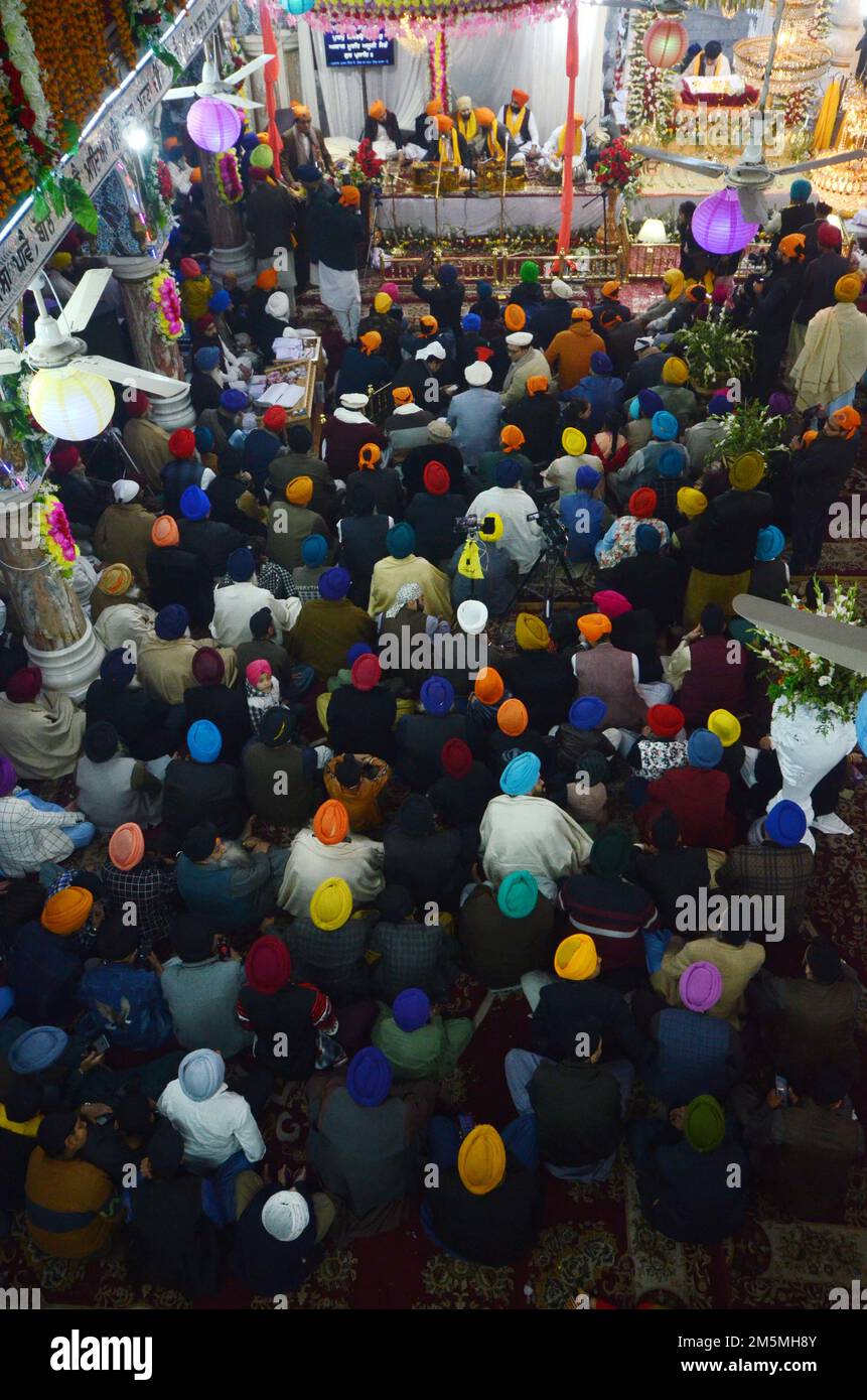 Peshawar, Pakistan. 28th Dec, 2022. Sikh devotees take part in a ...