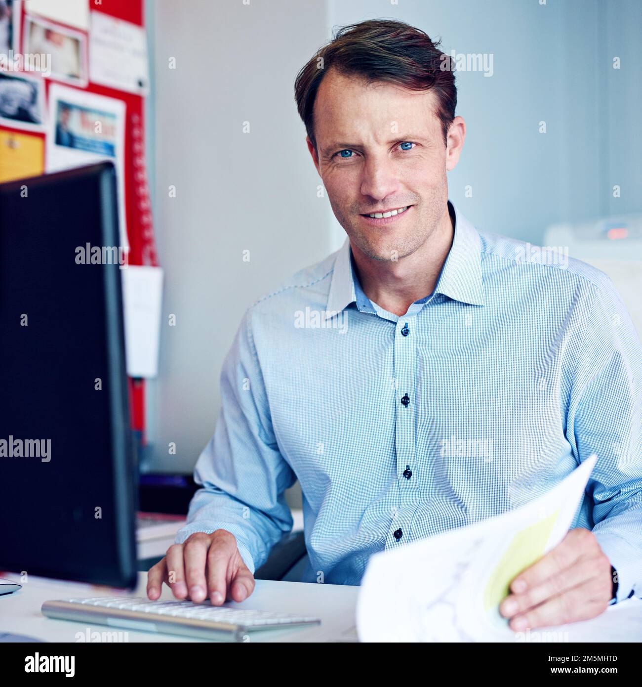 Im a self made success. Portrait of a businessman working at his desk ...