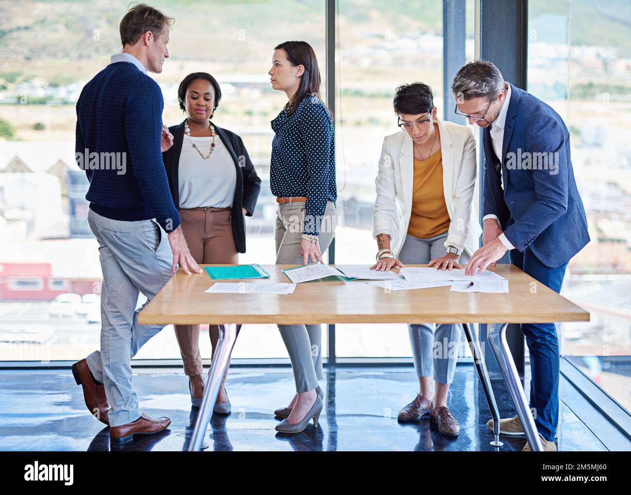 The planning process. Full length shot of corporate businesspeople ...