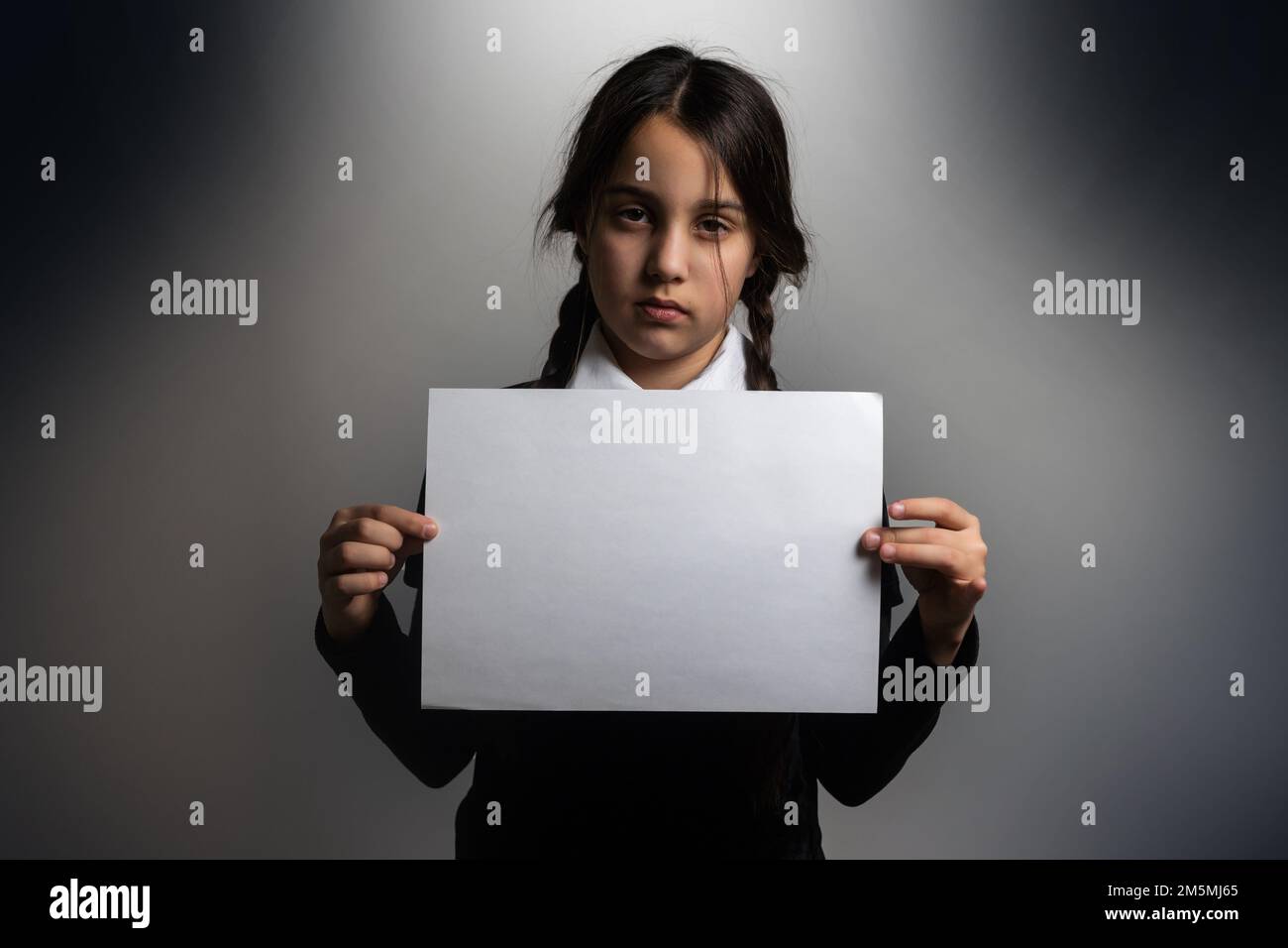 Wednesday Addams. Angry girl student Stock Photo - Alamy