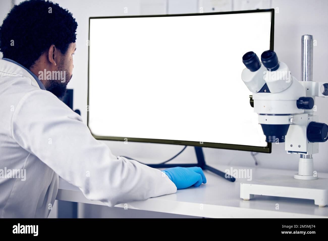 African scientist man, green screen and computer in research, reading ...